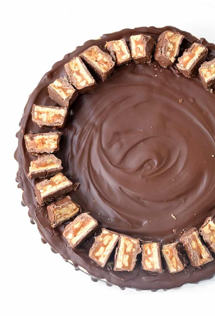 Peanut Butter Snickers Oreo Cheesecake - Sweetest Menu